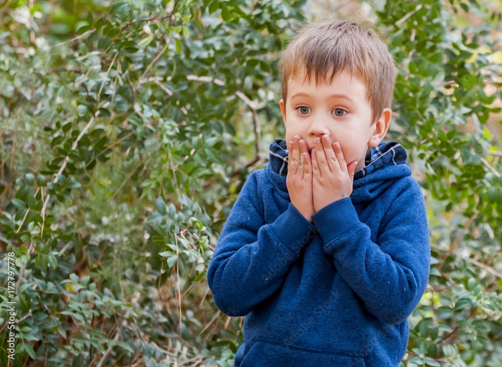 A scared closeup facial expression of a Caucasian child. Afraid of ...