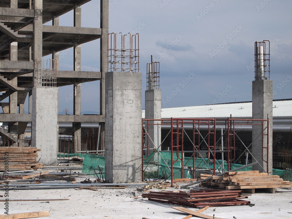 Casted concrete column at the construction site. Provided protruding ...