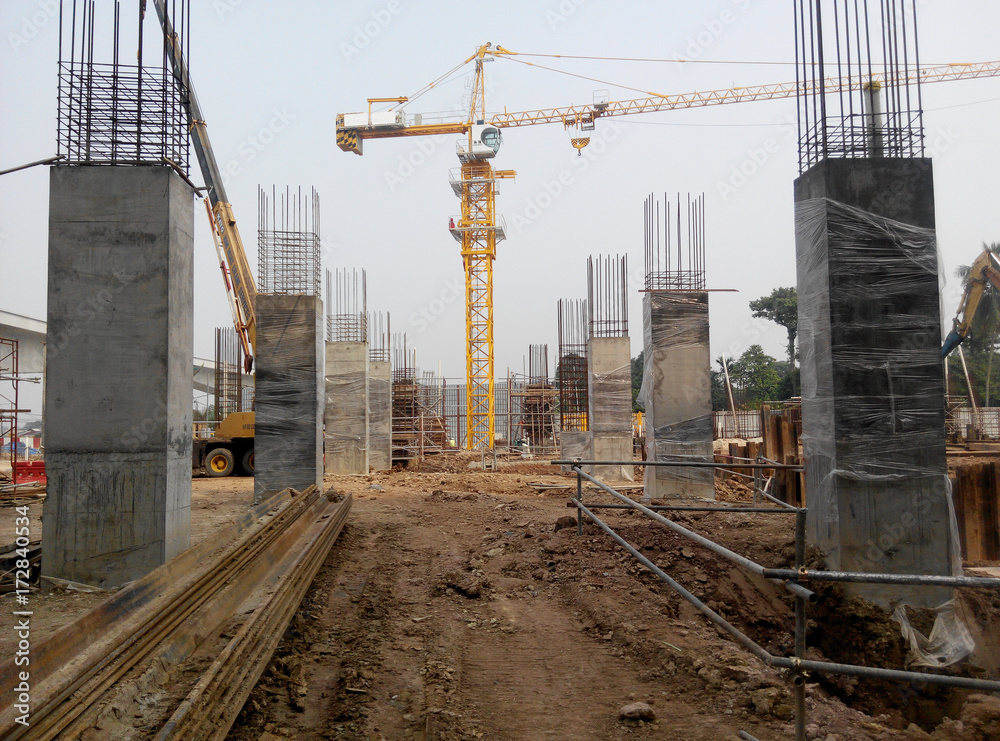 Casted concrete column at the construction site. Provided protruding ...