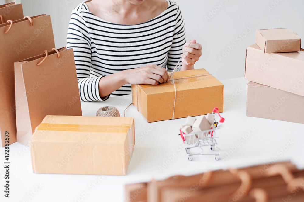 Manual worker working / packaging with boxes in store, shopping online ...