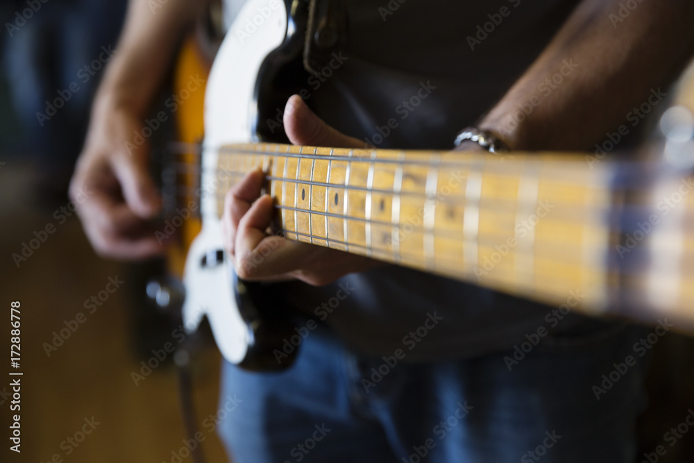 Bass player in studio Stock Photo | Adobe Stock
