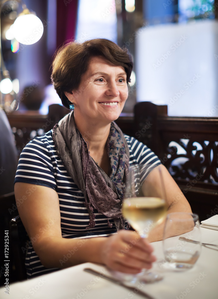 Elderly lonely woman at dinner in restaurant Stock Photo | Adobe Stock