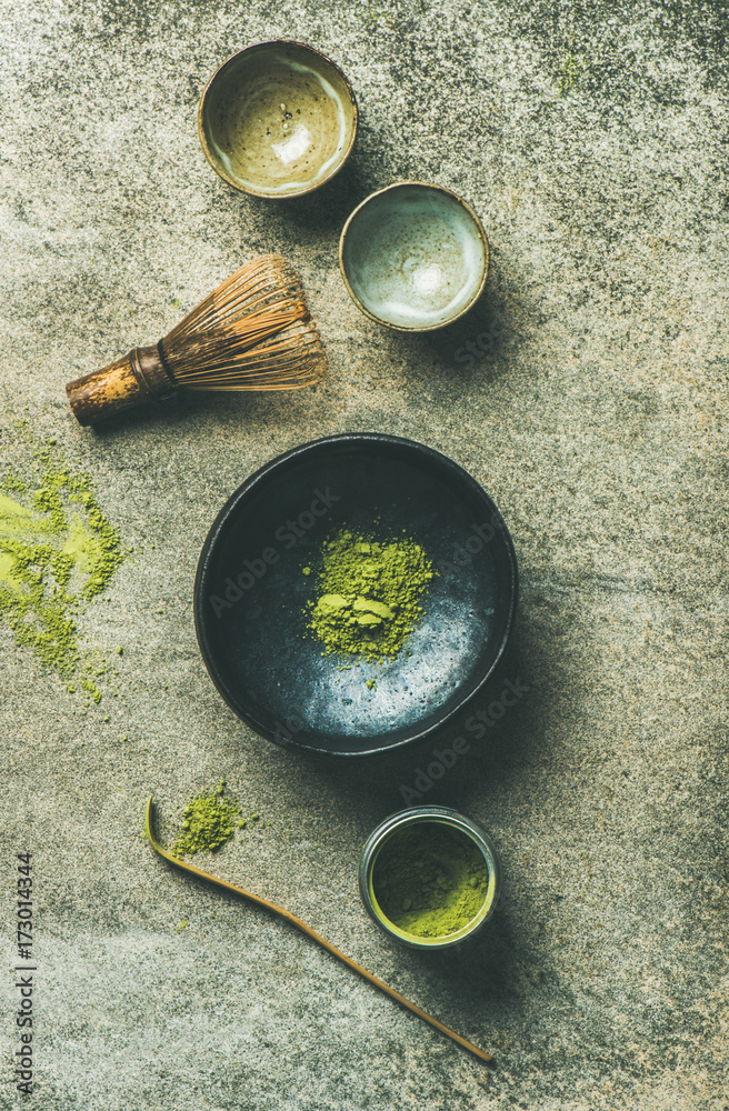 Flat-lay of Japanese tools for brewing matcha tea. Matcha powder in tin ...