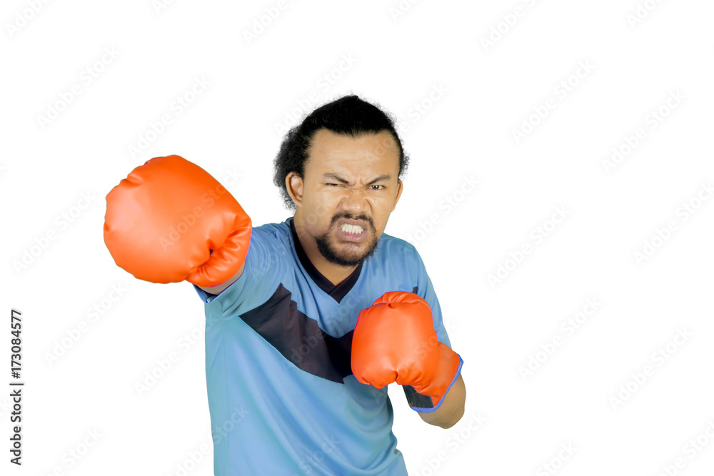 African man throwing a punch on the camera Stock Photo | Adobe Stock