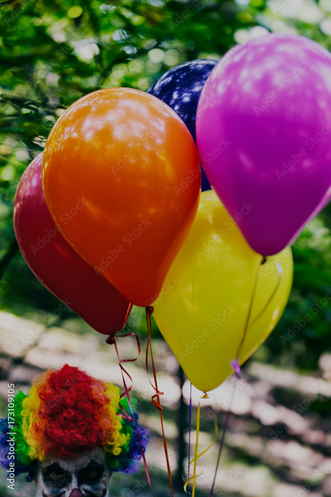 Scary Clown Holds Balloons Stock Photo | Adobe Stock