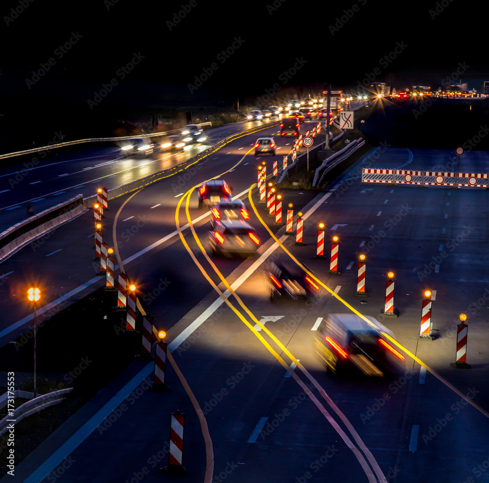 a construction site on a highway at night Stock-Foto | Adobe Stock