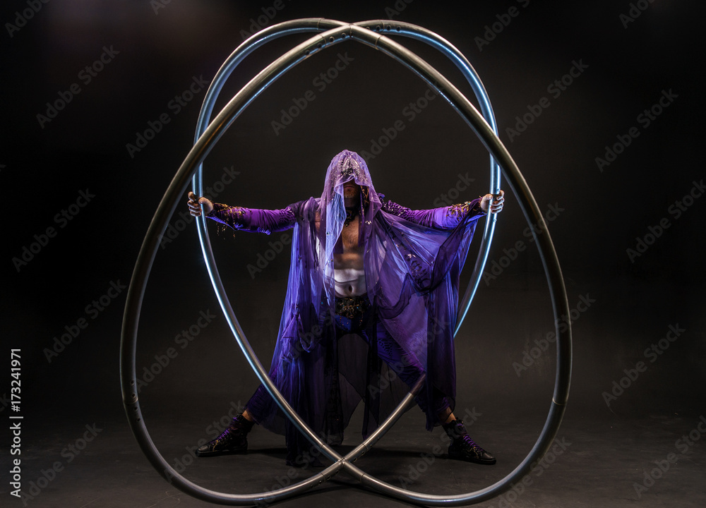 Assassin. Fairy-tale character in a bright purple suit with a hood and ...