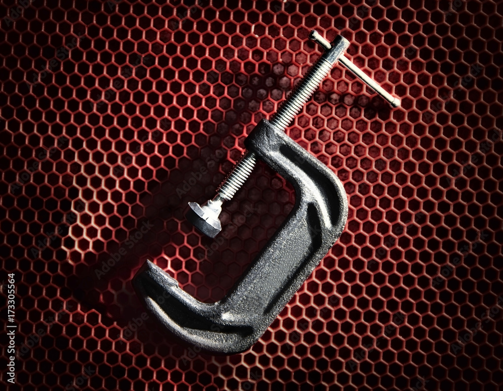 Clamp on Red Mesh Stock Photo | Adobe Stock