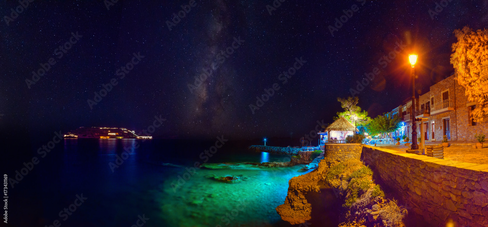 Night view of a street with night life, cafe and restaurants in Plaka ...