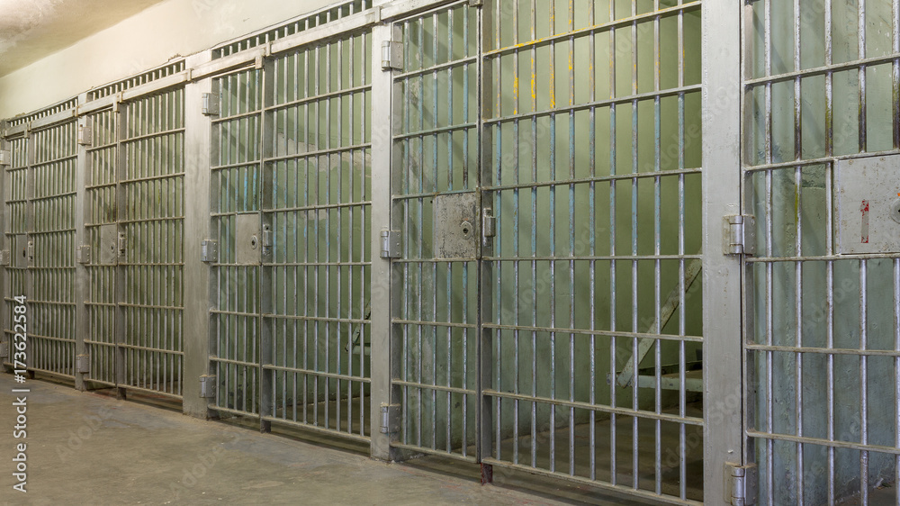 Bars of a prison with all the doors closed Stock Photo | Adobe Stock