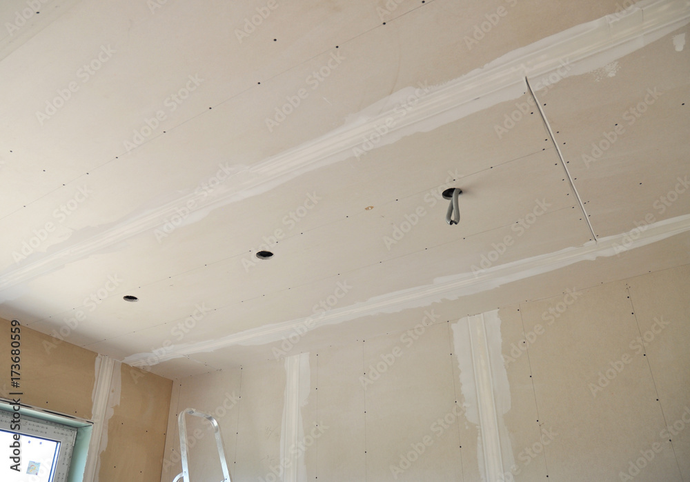 Ceiling construction and repair with drywall board. Building ...