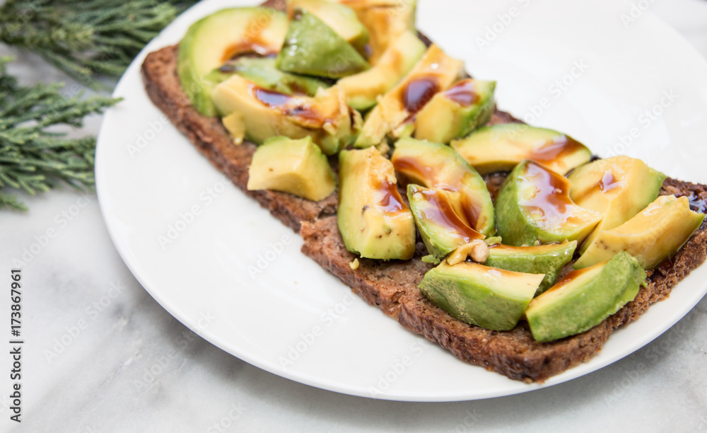 Sliced avocado sandwich butterbrod with glaze vinegar Stock Photo ...