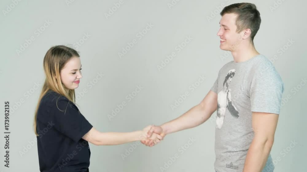 Man and girl shaking hands on white background. Closeup portrait of ...