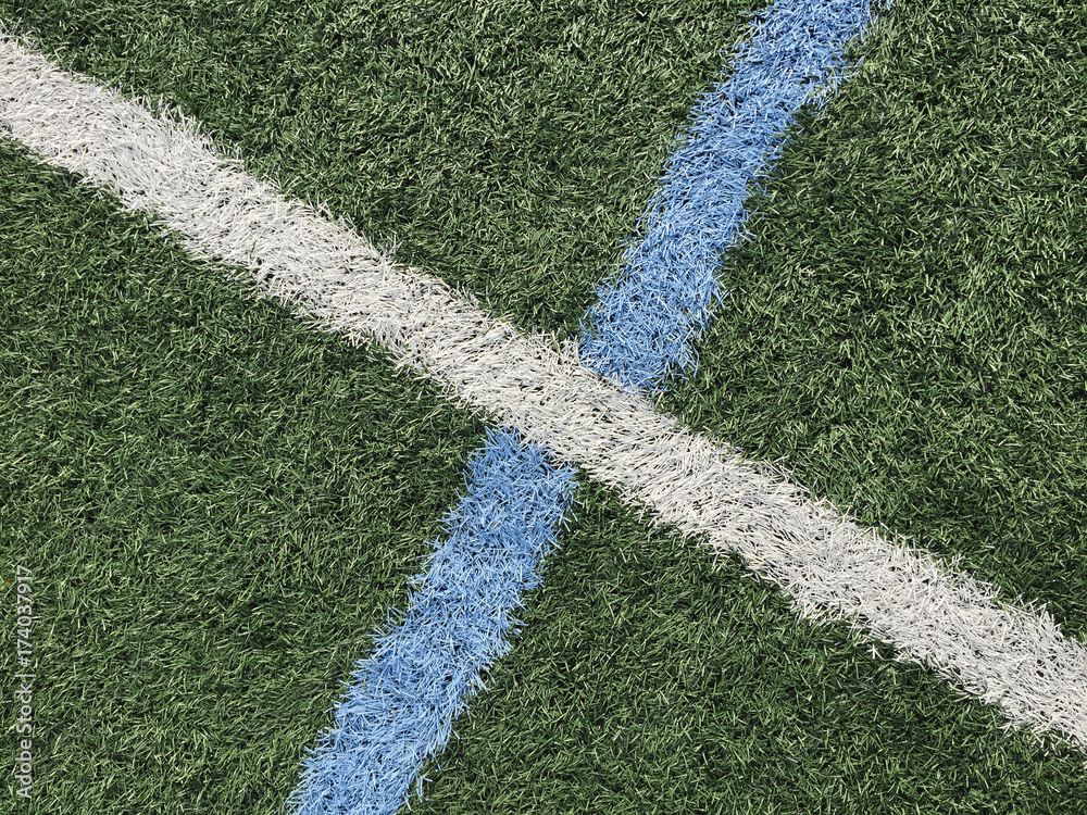 Foto de Colorful boundary lines on artificial turf sports field do ...