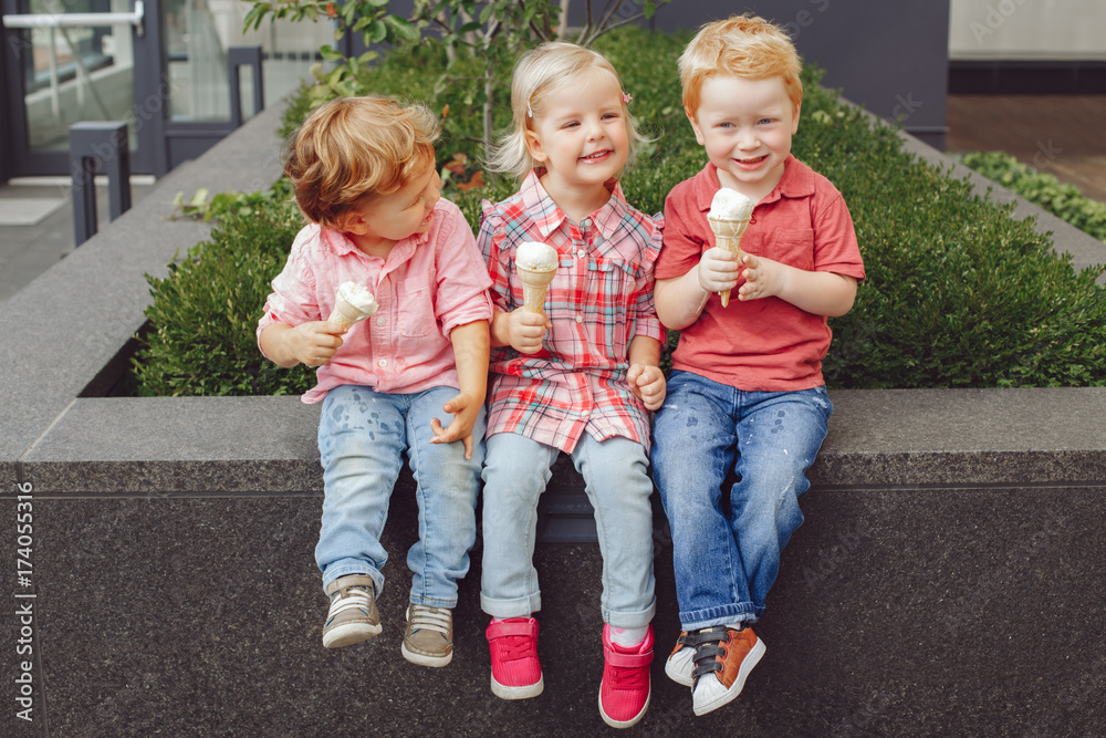 Group portrait of three white Caucasian cute adorable funny children ...