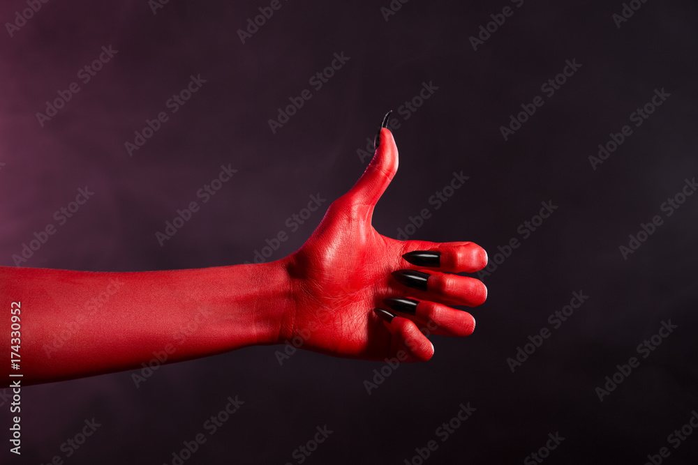 Red skin devil hand showing thumbs up Stock Photo | Adobe Stock