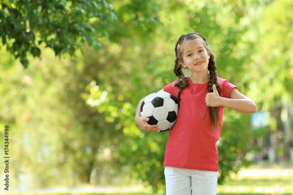 Cute girl with soccer ball in park Stock Photo | Adobe Stock