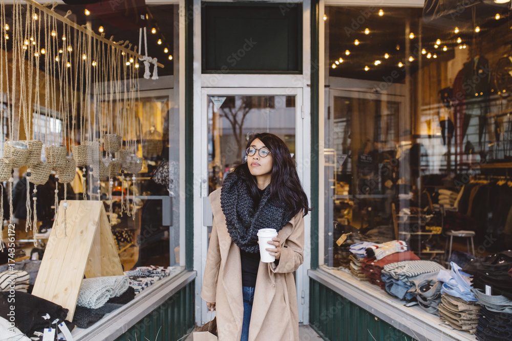 Stylish woman shopping at urban boutique Stock Photo | Adobe Stock