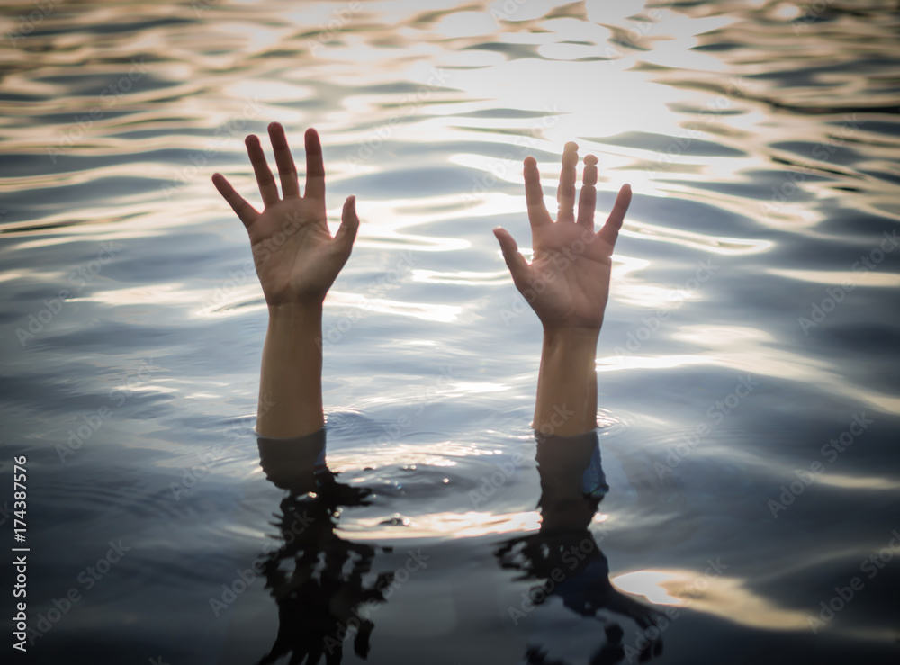 Drowning victims, Hand of drowning woman needing help, with selective ...