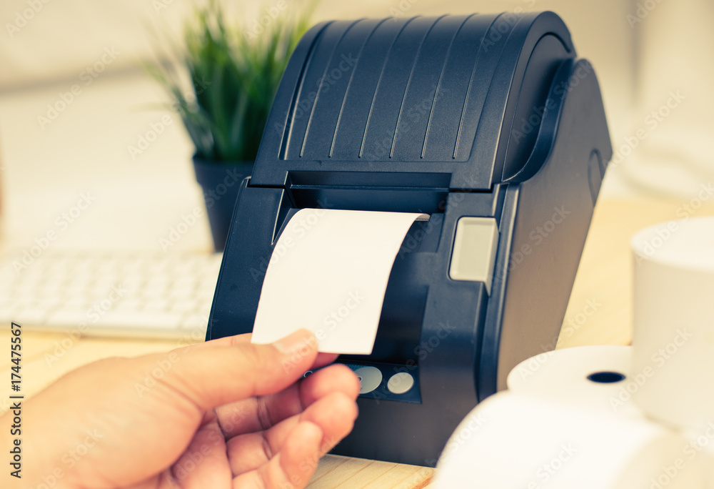 Office equipment, A point of sale receipt printer printing a receipt ...