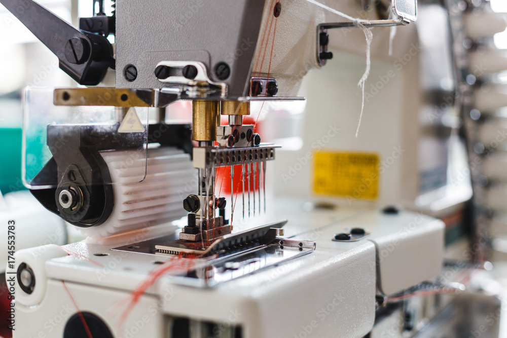 Closeup detail of the sewing machine. Sewing process in the phase of ...