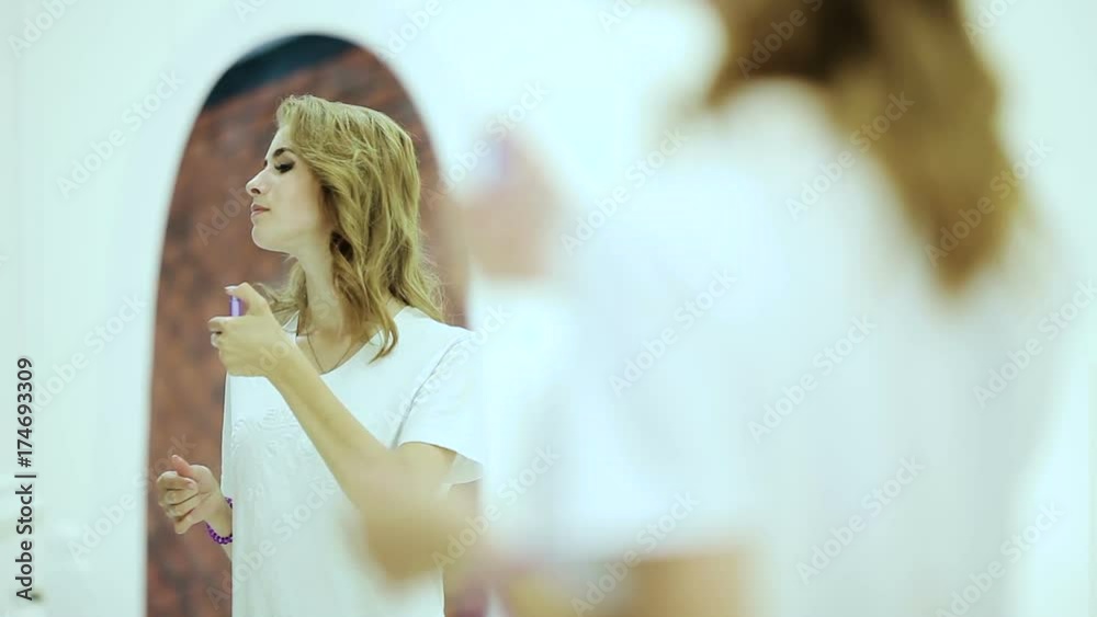 Woman spraying perfume on neck and body. Girl with perfume Stock Video ...