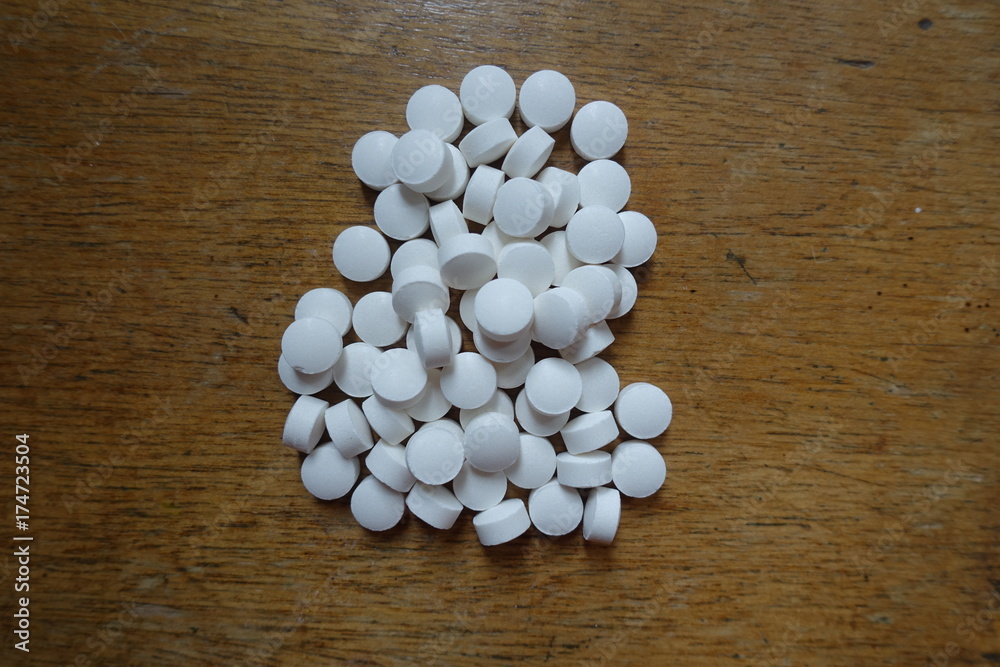 Pile of white xylitol tablets from above Stock Photo | Adobe Stock