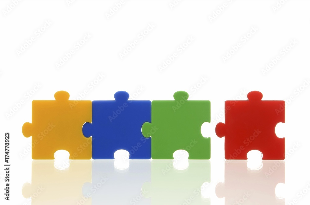 Foto de Different coloured puzzle pieces, three puzzle pieces connected ...