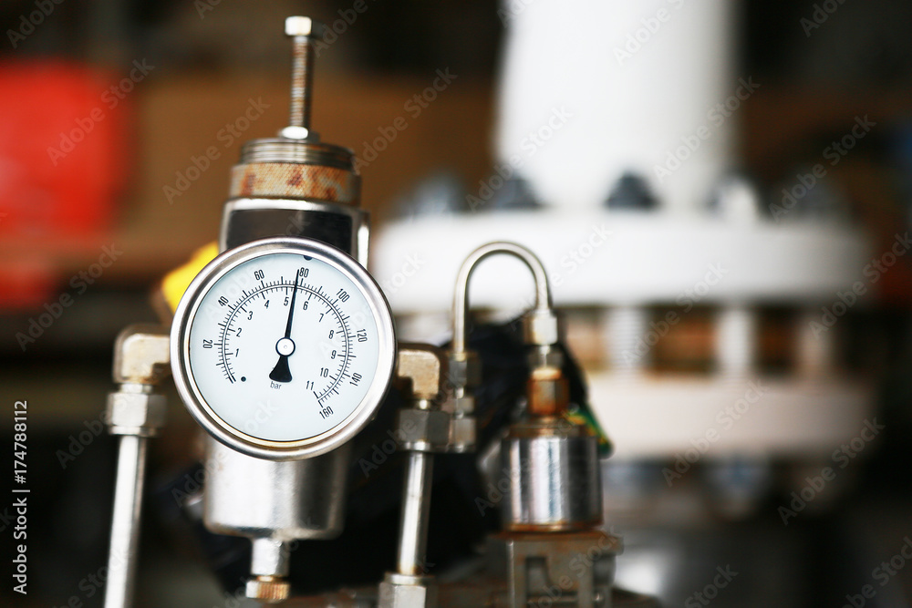 Pressure gauge using measure the pressure in production process. Worker ...