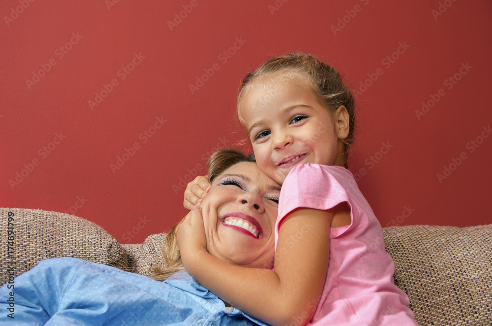Cute little girl adoring her mother, mother-daughter love, girl hugging ...