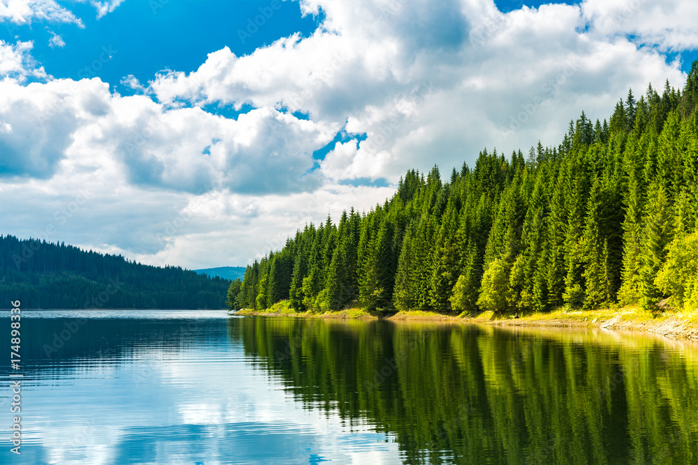 Vidra dam lake. Vidra Lake is a storage reservoir, located in the ...