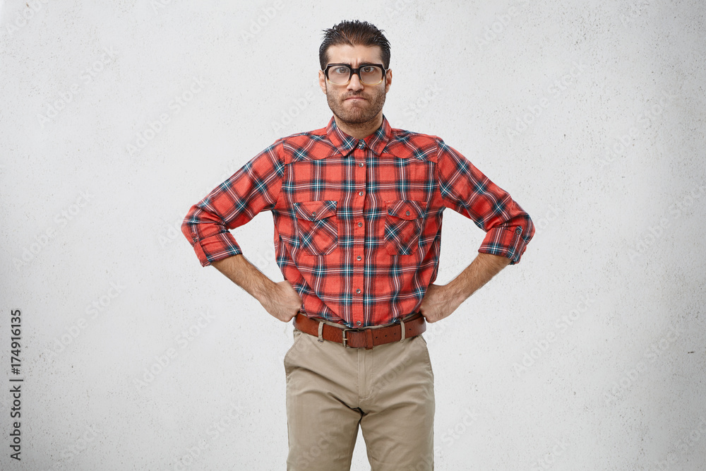 Portrait of furious bearded dark haired man geek looking ridiculous in ...