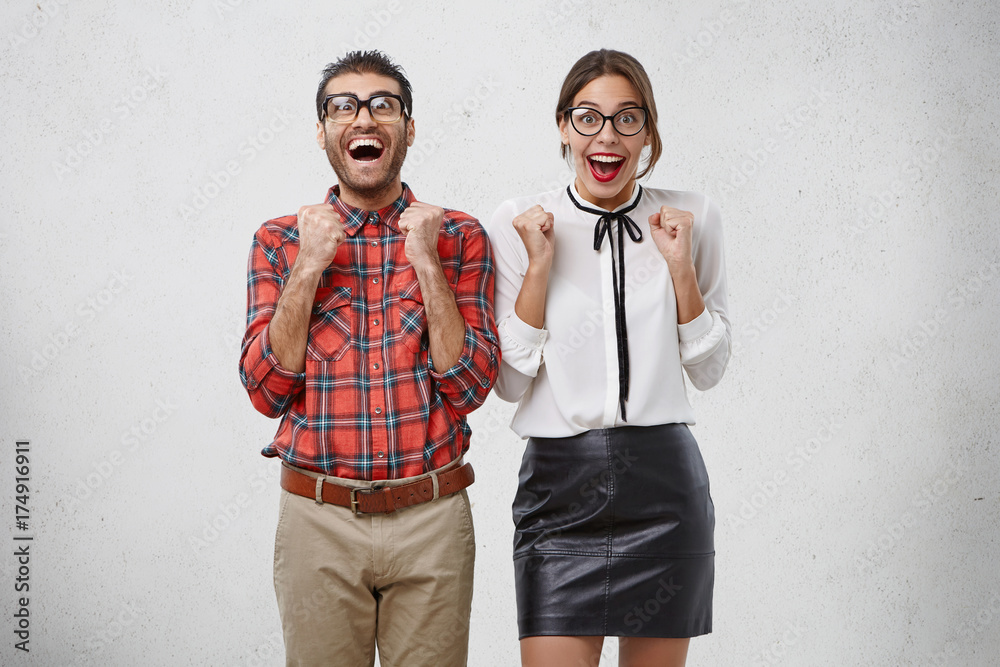 People, happiness and joy concept. Overjoyed excited male and female ...