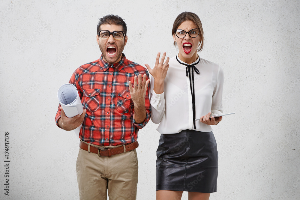 Emotional angry construction workers scream loudly at office staff ...