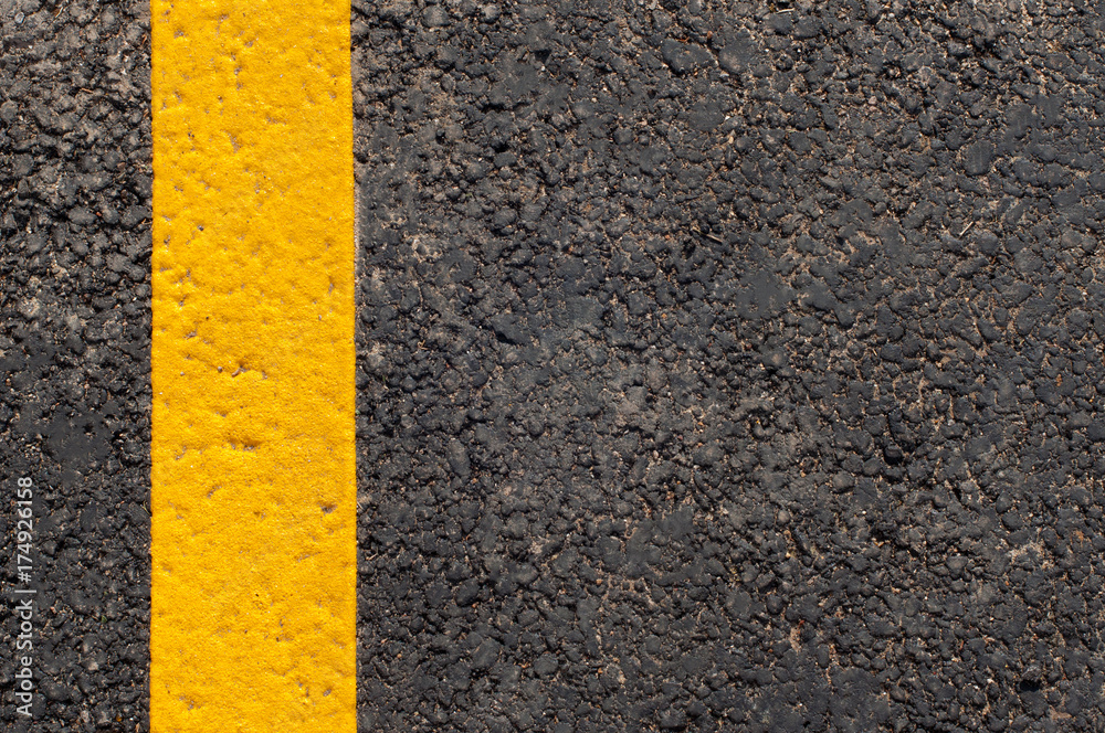 Yellow line on the road texture background Stock Photo | Adobe Stock