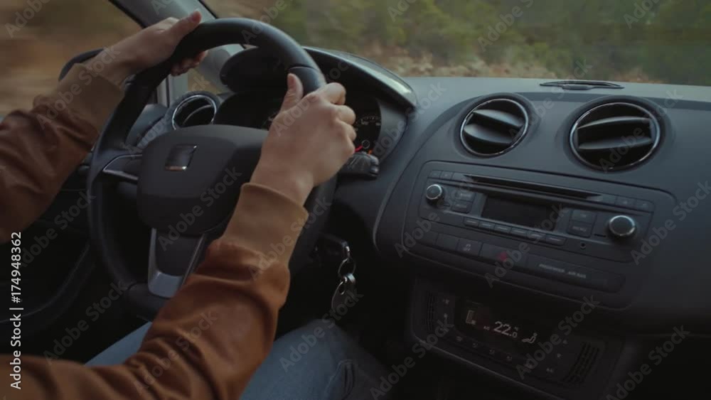 Video Stock Close up of woman hands on top of steering wheel of small ...
