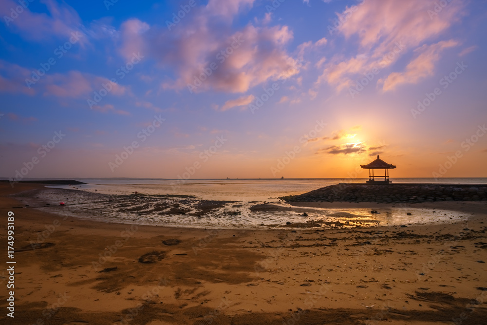 Beautiful sunrise on a beach in Bali Indonesia with colourful sky as ...