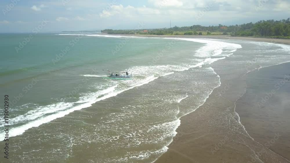 AERIAL, CLOSE UP: Flying above unrecognizable Balinese fishermen ...