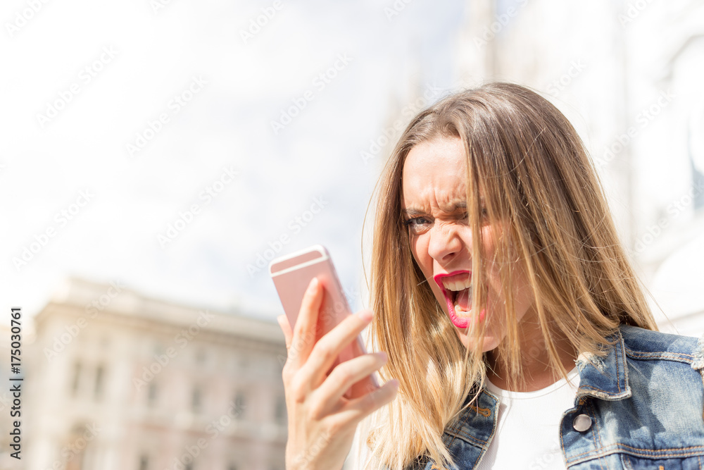 Angry and upset teenager screaming at the mobile telephone Stock Photo ...