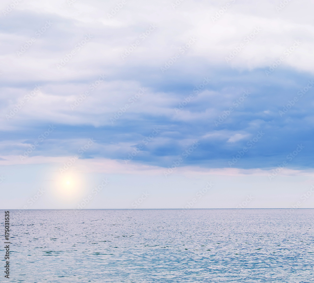 Sea simple view. Delicate colors of the sea and sky, the incoming foamy ...