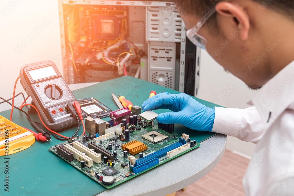 The abstract image of the asian technician putting a CPU in the CPU ...