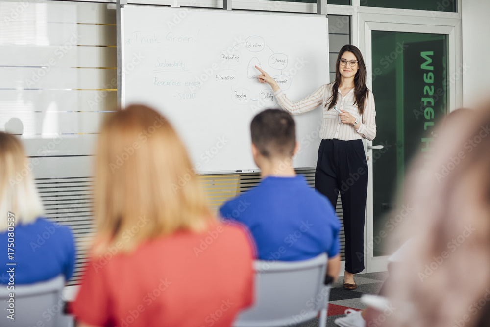 Teacher Explaining Chart on Whiteboard Stock Photo | Adobe Stock