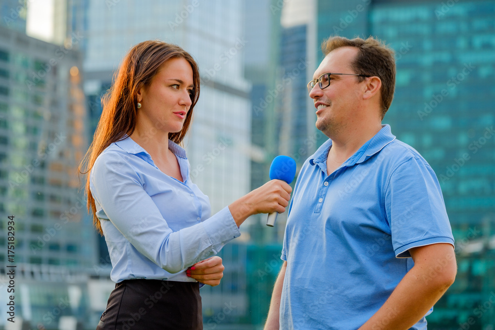 Young girl TV reporter interviews a man Stock Photo | Adobe Stock