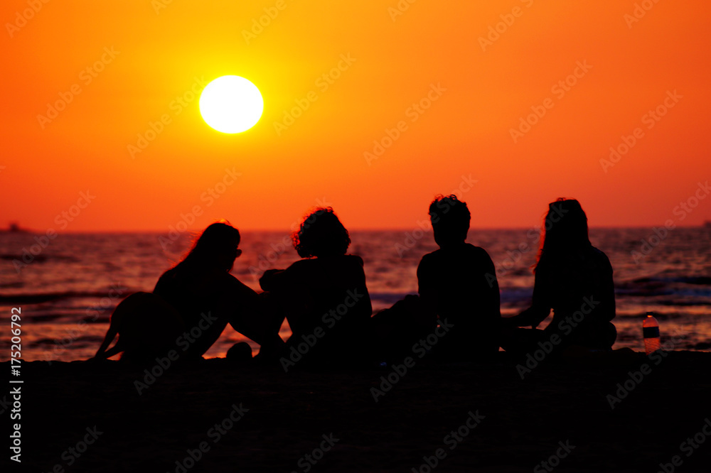 Group of friends on the beach. Happy moments of life. People silhouette ...