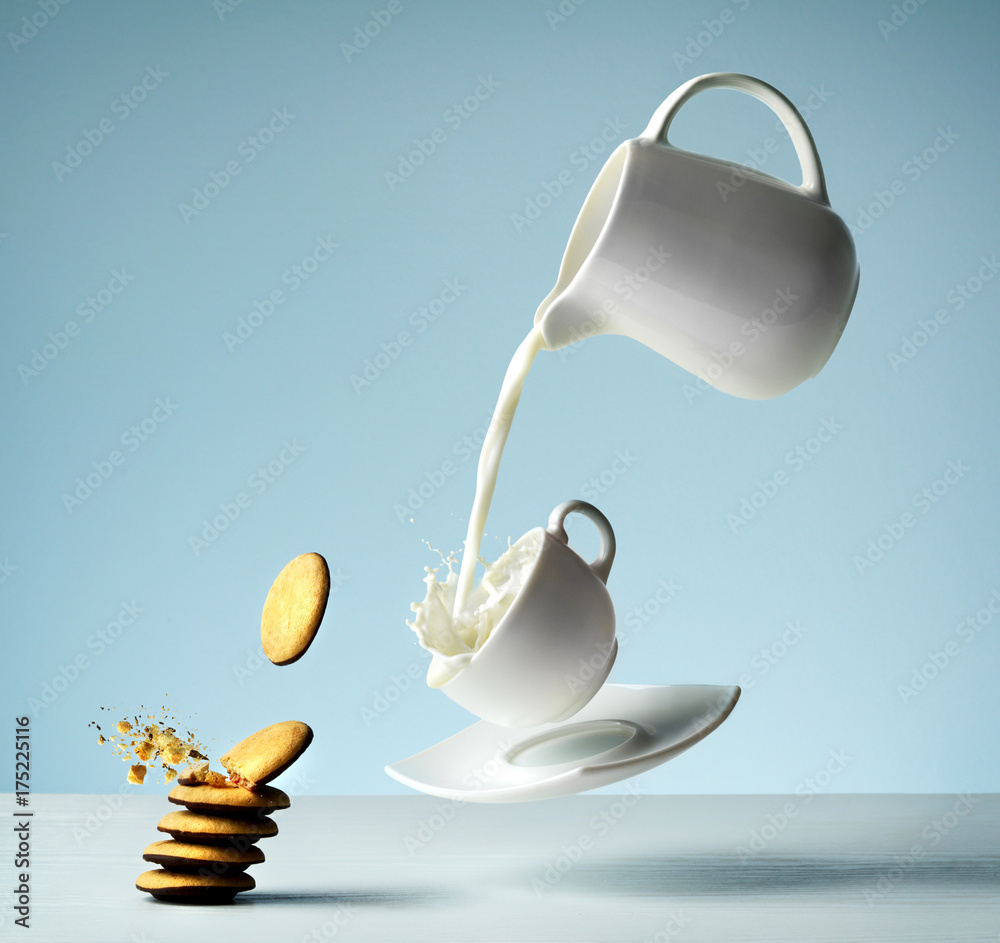 Flying cup with milk Stock Photo | Adobe Stock