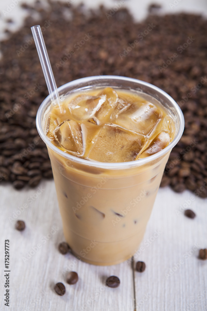 Iced Coffee with ice and a straw Stock Photo | Adobe Stock