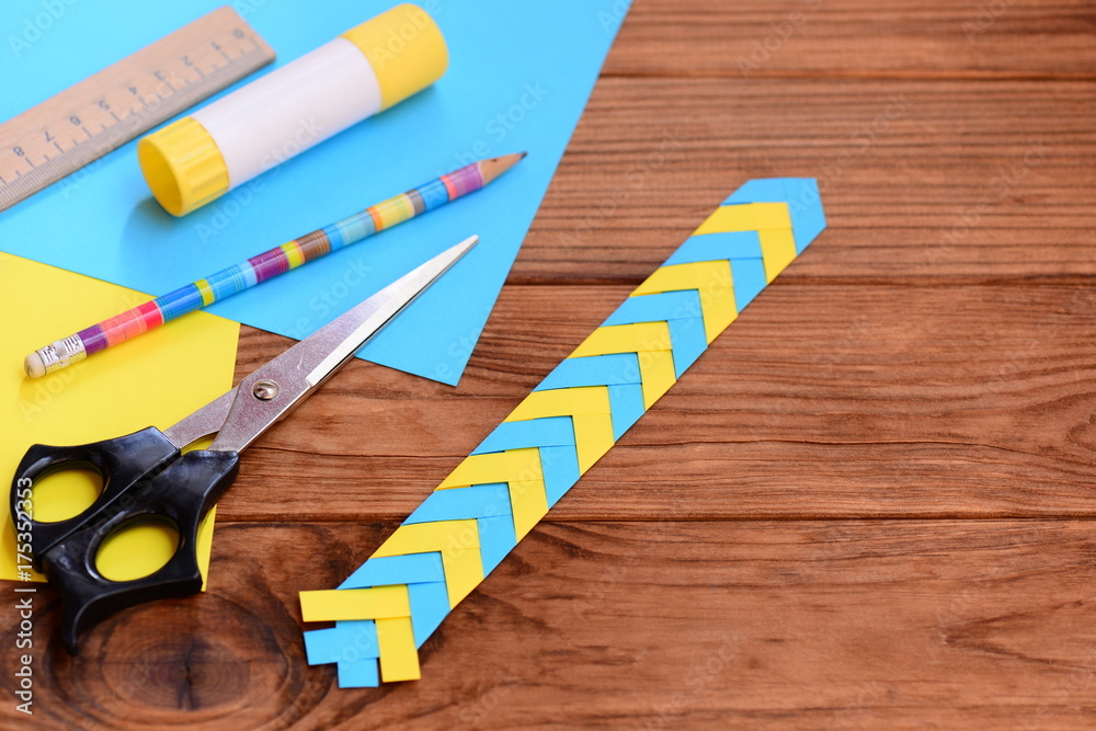 Kids paper bookmark on a brown wooden background with empty place for ...