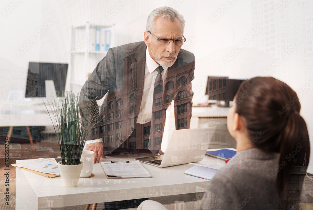 Strict boss having prejudices against his female office worker Stock ...