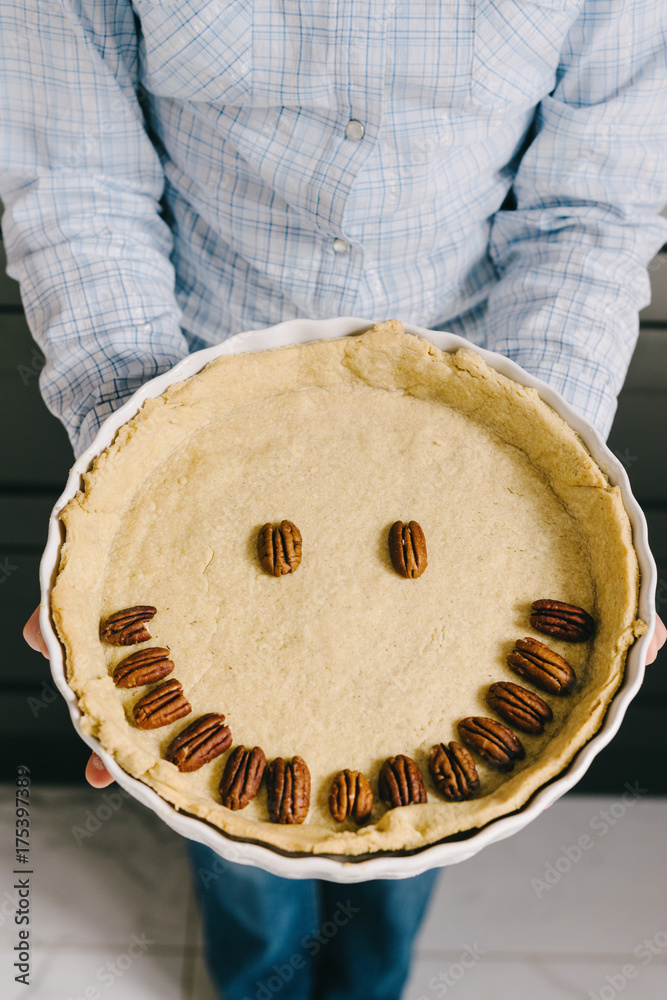 smiley face pecan nuts in a pie pastry Stock Photo | Adobe Stock