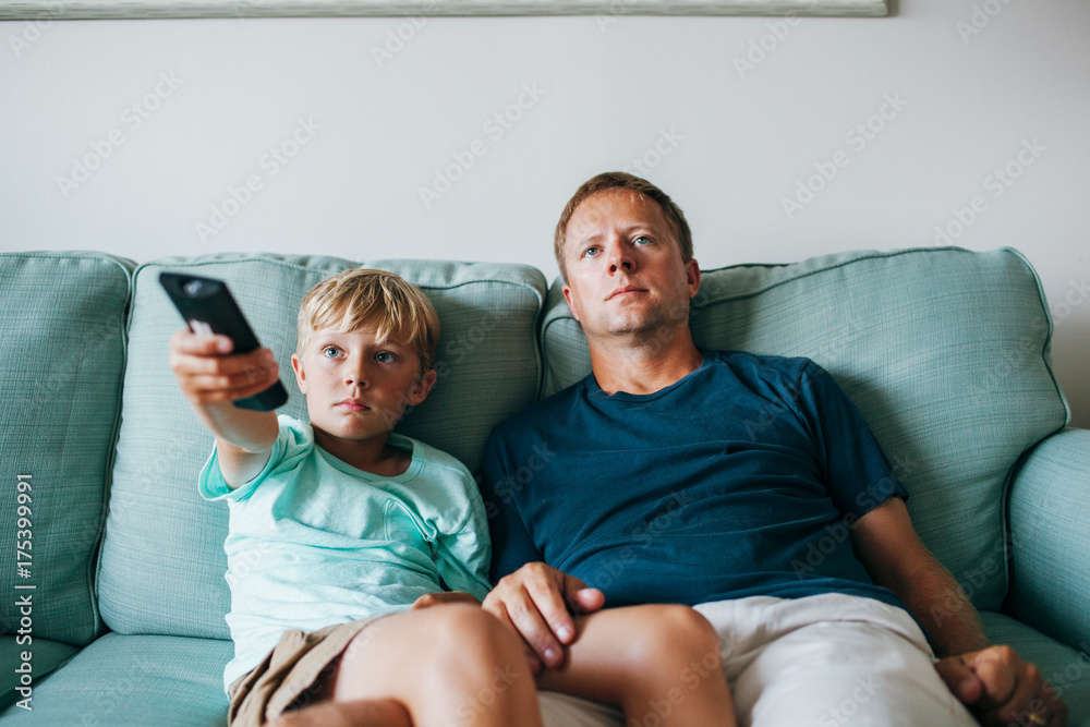 child changes channels on tv Stock Photo | Adobe Stock